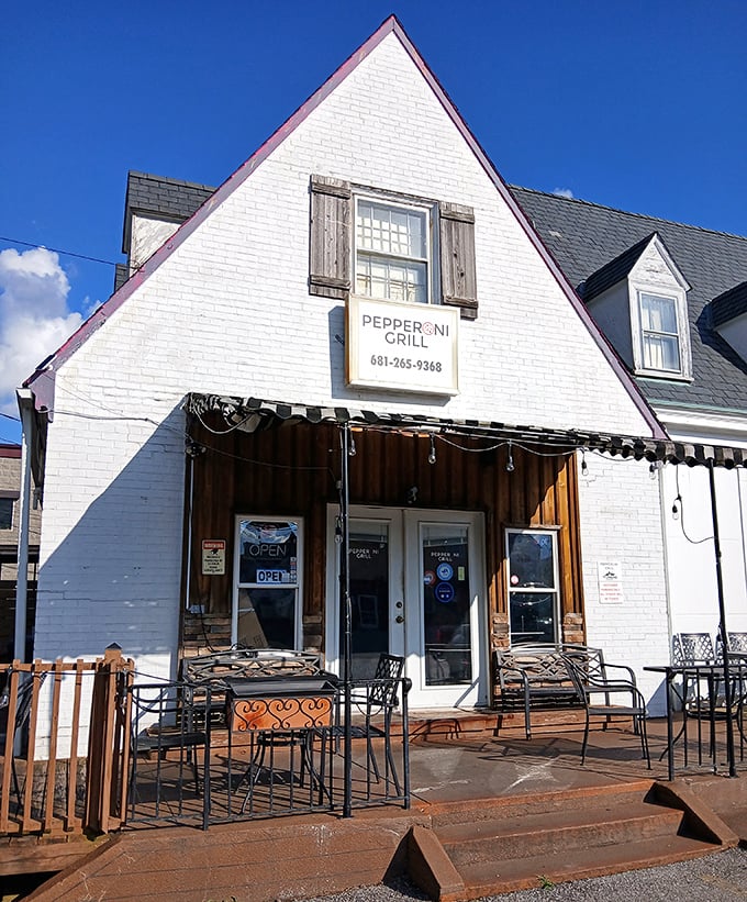 Classic white building with brown shutters screams "comfort food done right" from every charming angle.