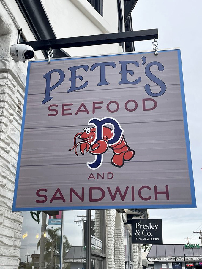 Pete's Seafood sign promises simple pleasures done right. That cartoon lobster looks as happy as you'll be after eating here!
