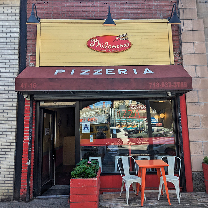 That cheerful yellow-and-red facade invites you into a cozy corner where authentic pizza and small-town warmth meet in perfect harmony.