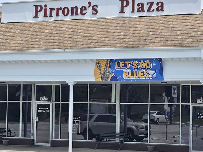 Pirrone's keeps it simple—no flash, just a promise of pizza perfection behind those windows.