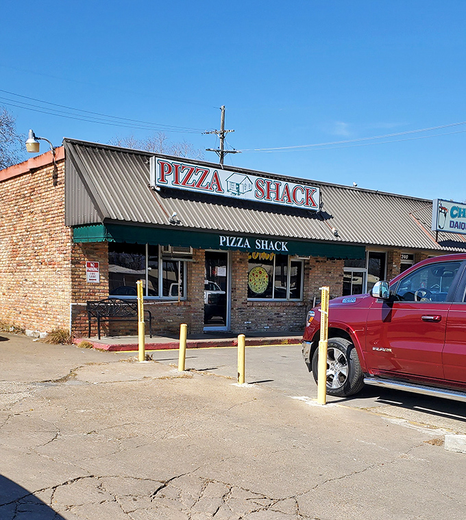 Pizza Shack's no-nonsense exterior tells you they're too busy making amazing pizza to worry about fancy facades. Priorities, people!