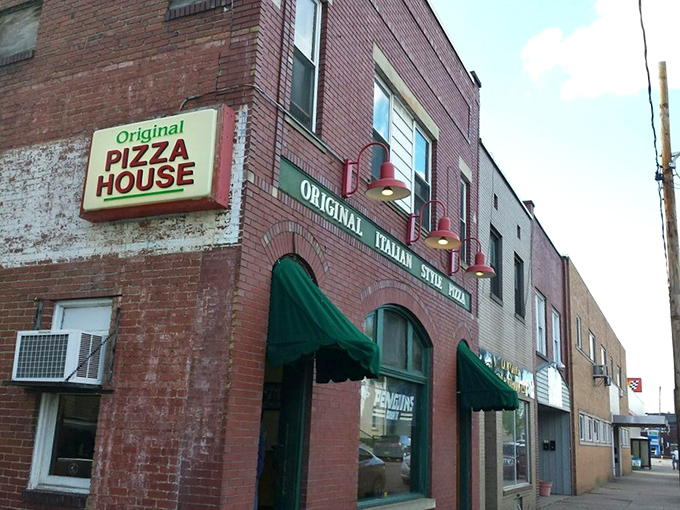 Red brick authenticity meets neighborhood charm where every pizza tells its own delicious story.