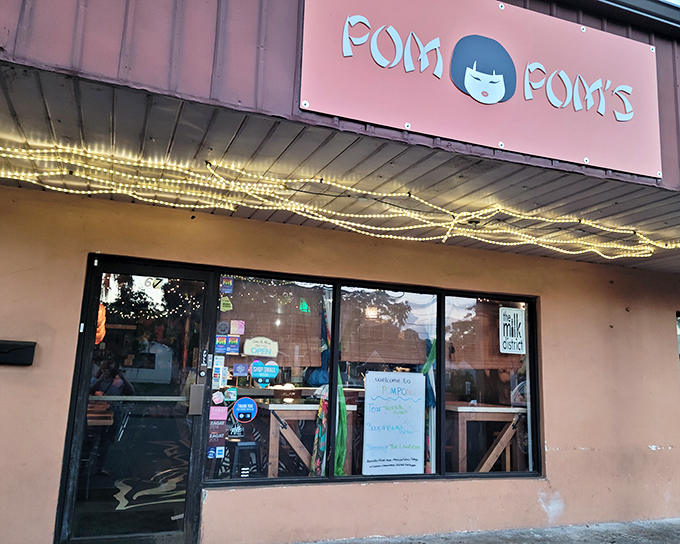 Pom Pom's pink facade and twinkling lights create an inviting atmosphere for sandwich lovers.