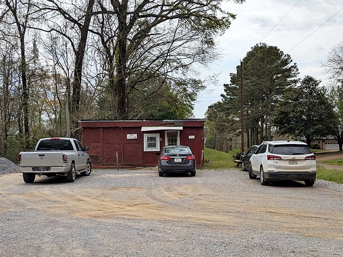 Red's tiny red shack sits quietly among the trees, a humble temple to hot dog perfection in rural Mississippi.