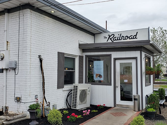 The Railroad Diner's unassuming entrance hides culinary treasures inside, proving great diners, like great books, shouldn't be judged by covers.