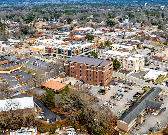 The hills surrounding Rockingham create a natural embrace, as if the landscape itself is welcoming you home.