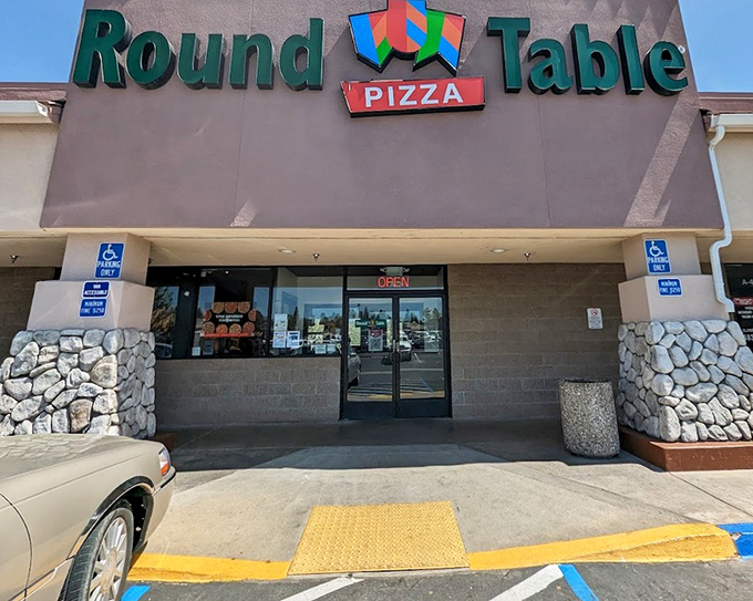 Round Table's castle-themed exterior promises medieval-sized portions and family-friendly pizza adventures inside those stone-accented walls.