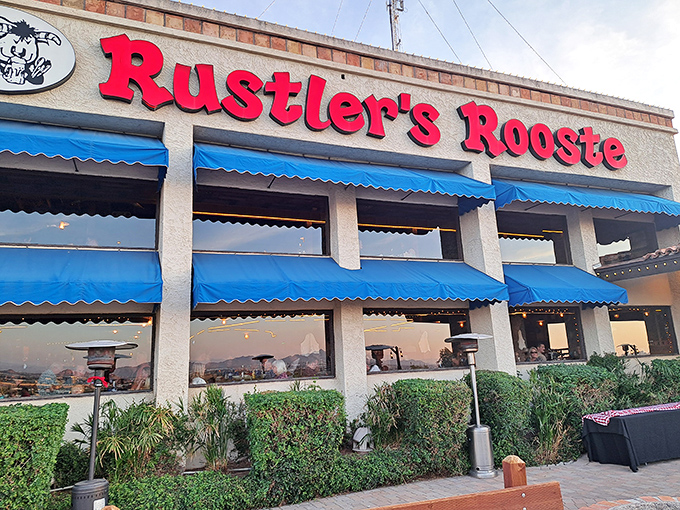 Rustler's Rooste's modern exterior hides a playful secret&mdash;there's a slide inside! The blue awnings are just a preview of the spectacular Phoenix views waiting inside.