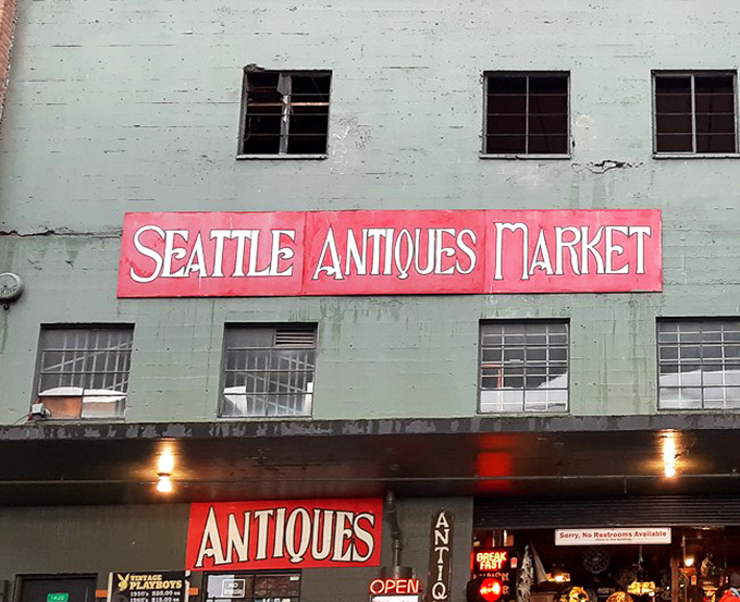 Seattle Antiques Market's vintage sign has become an icon of the waterfront. It's been guiding bargain hunters for generations.