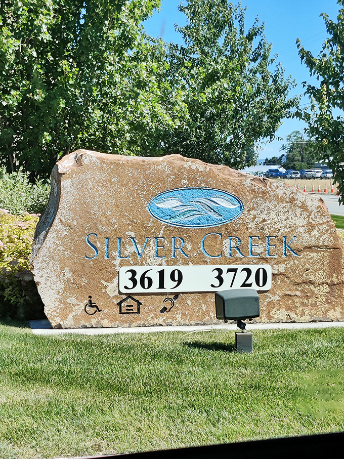 Silver Creek's natural stone marker sits perfectly in Post Falls' scenic retirement landscape setting.