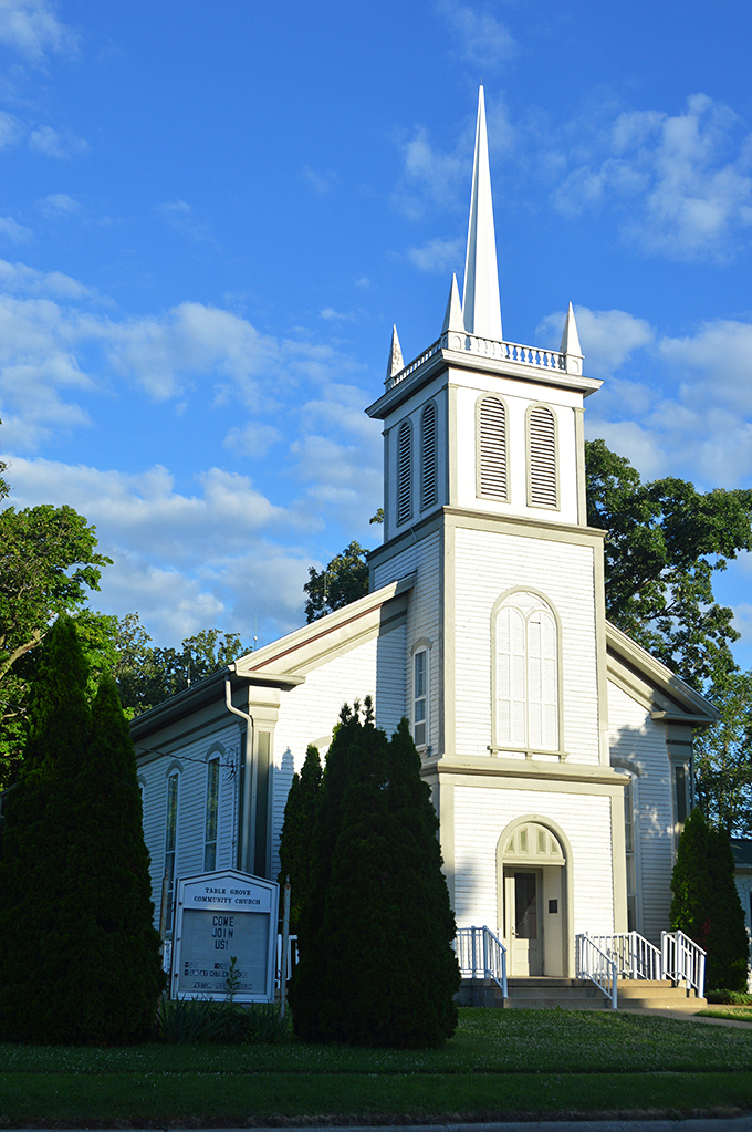 That steeple! Table Grove Community Church reaches skyward like a pristine white exclamation point on the Illinois landscape.