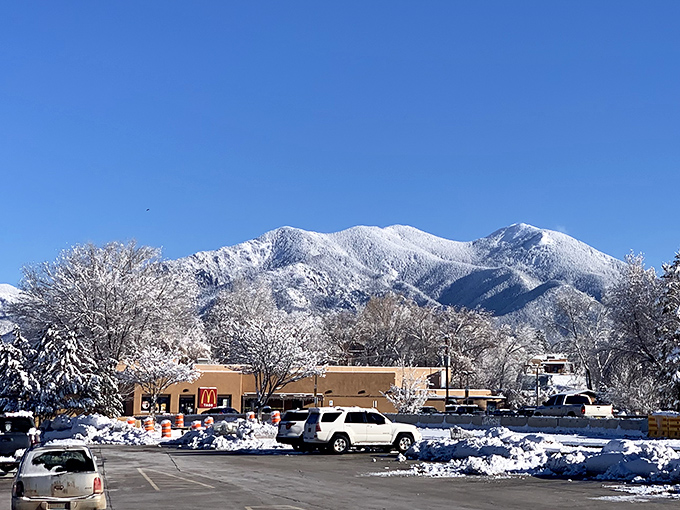 Taos' snow-capped mountains create a postcard backdrop for everyday errands, turning even a McDonald's run into a scenic adventure.