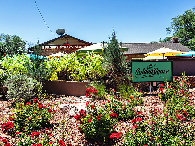 The Golden Goose: Desert blooms frame this hidden gem like nature's own welcome mat. The garden might be pretty, but the steaks are the real attraction.