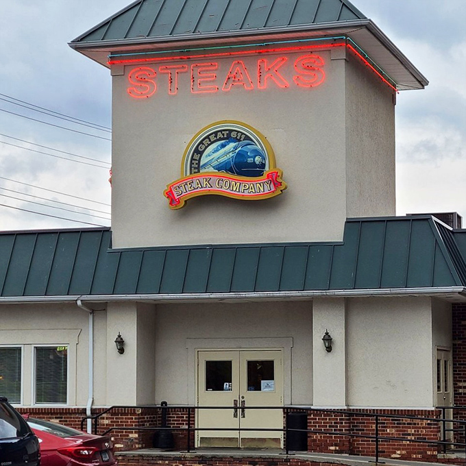 The Great 611 Steak Company's glowing sign cuts through evening fog like a beacon for the beef-obsessed.