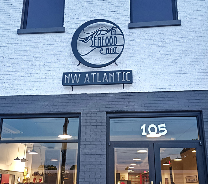 The Seafood Place (sign): "Sleek and straightforward. The Seafood Place's elegant signage hints at the fresh, no-frills approach waiting inside."