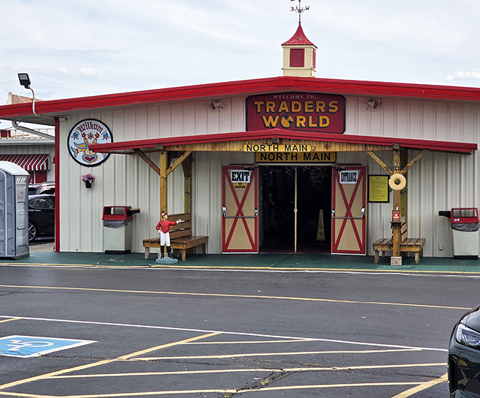Welcome to Traders World! The distinctive red barn entrance promises a day of discoveries that'll have you saying "I didn't know I needed that!"