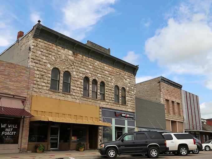 Those magnificent brick storefronts with their ornate arched windows create a stunning Victorian streetscape.
