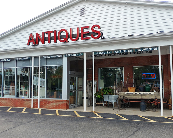 That bold red "ANTIQUES" sign is like a beacon to collectors. No subtlety needed when the treasures are this good!