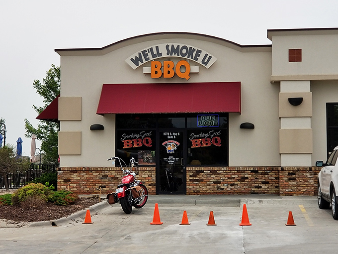 We'll Smoke You BBQ means business with that bold red awning, promising flavors that'll knock your socks clean off.