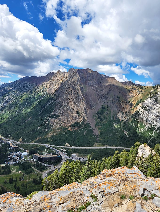 Alta's mountain backdrop rises like ancient cathedral spires reaching toward endless Utah skies above.