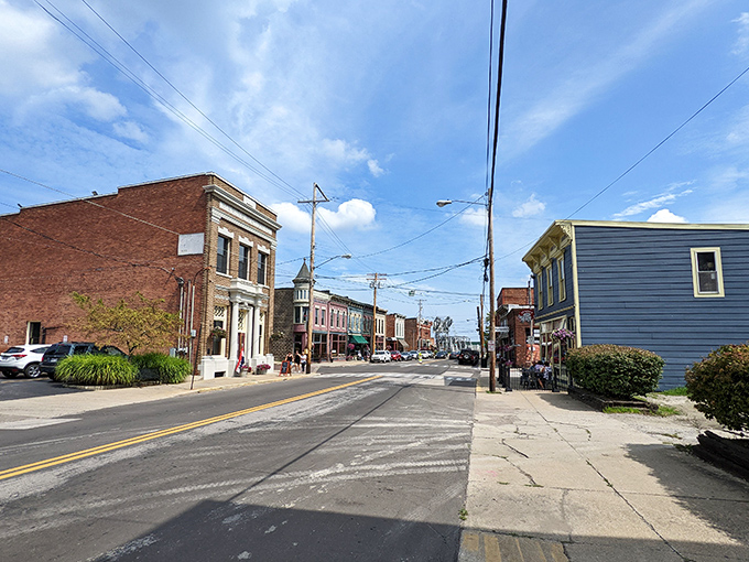 A sunny afternoon in Ashtabula brings cheerful views of colorful storefronts, friendly faces, and the charm of downtown life.