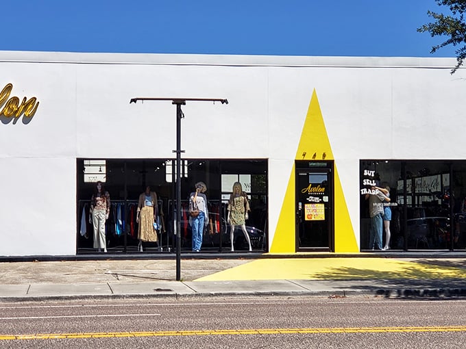 The yellow triangle entrance says "fashion-forward" while the mannequins say "come find your next conversation-starting outfit."