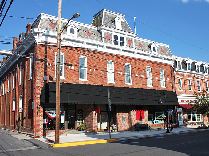 Sunny skies shine over downtown Bedford, where charming brick buildings, local shops, and friendly faces create a welcoming small-town feel.