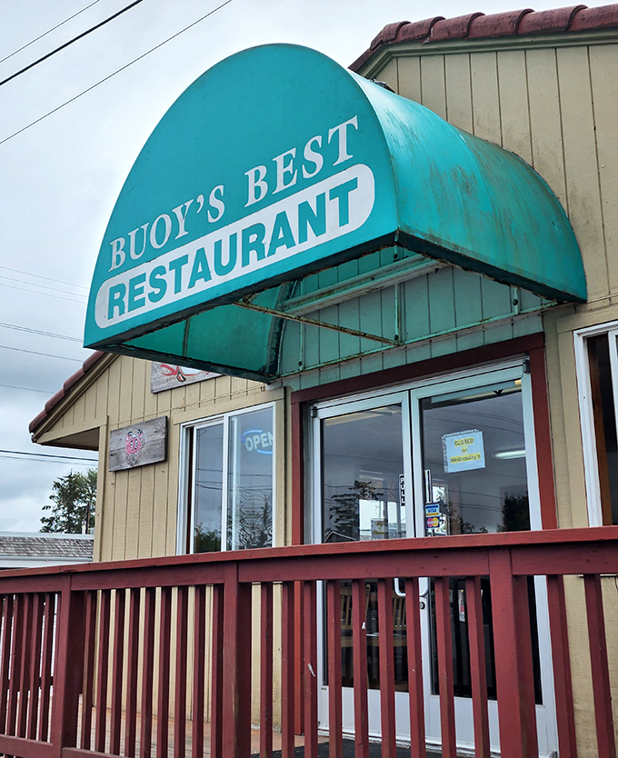 The turquoise awning of Buoy's Best beckons seafood lovers with the promise of ocean-fresh delights inside.