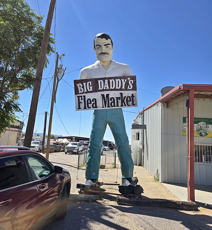 That giant friendly figure knows exactly what he's doing - welcoming treasure hunters to paradise!