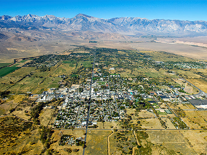 An aerial view of Bishop shows its perfect positioning in the Owens Valley. Nature's grandstand surrounds this affordable high desert gem.