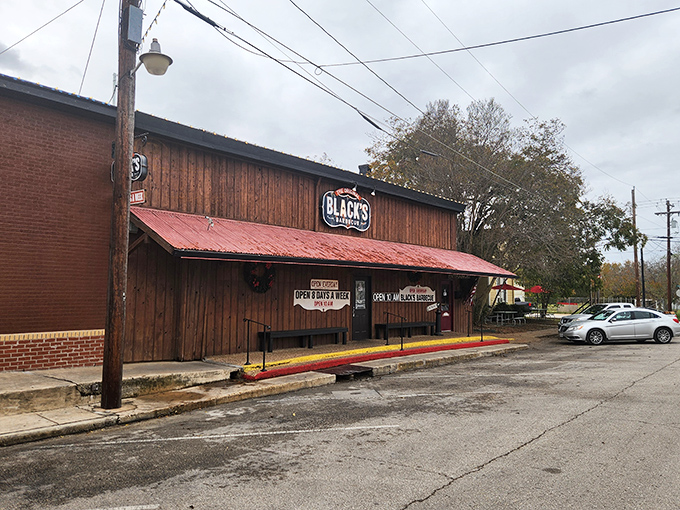 Black's classic brick facade hides generations of smoking wisdom and family BBQ secrets inside.