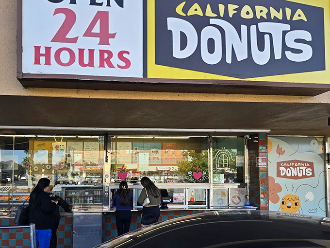 The neon sign says it all - California Donuts is ready whenever your midnight sugar craving strikes.