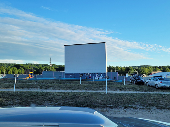 Cars gather like old friends at the Cherry Bowl Drive-In. Some conversations happen before the movie, others during intermission.