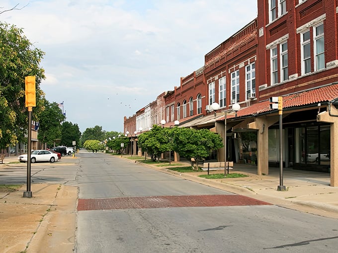 Evening light bathes Coffeyville's brick buildings in golden warmth, making everything look like a Norman Rockwell painting.
