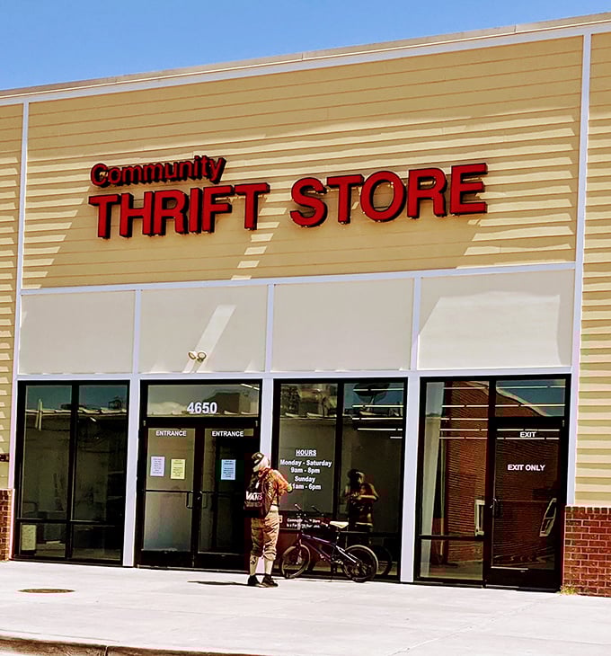 Bright red letters against yellow siding &ndash; this Community Thrift Store stands out like a beacon for savvy shoppers.