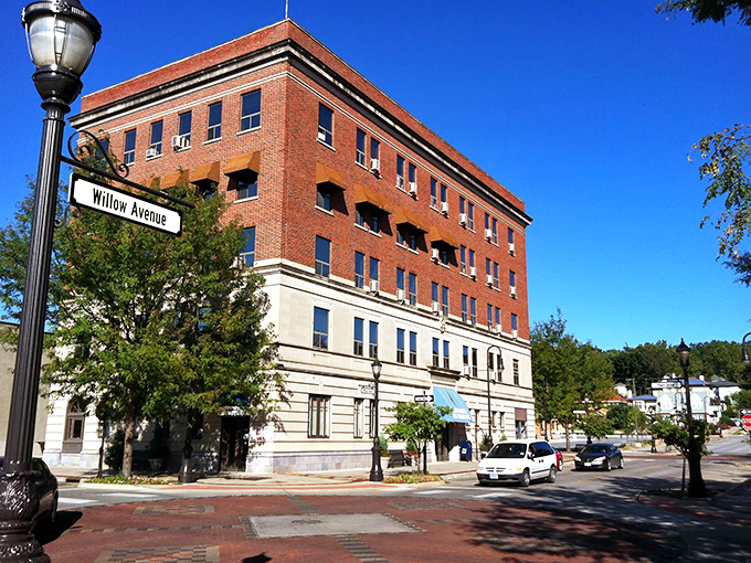 A bright day in downtown Council Bluffs where charming streets, classic architecture, and friendly locals create a welcoming small-town atmosphere.