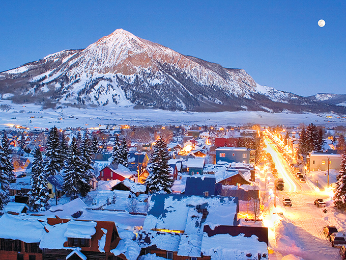 Crested Butte glows under winter's blanket, looking like a Christmas village that forgot to take down decorations.
