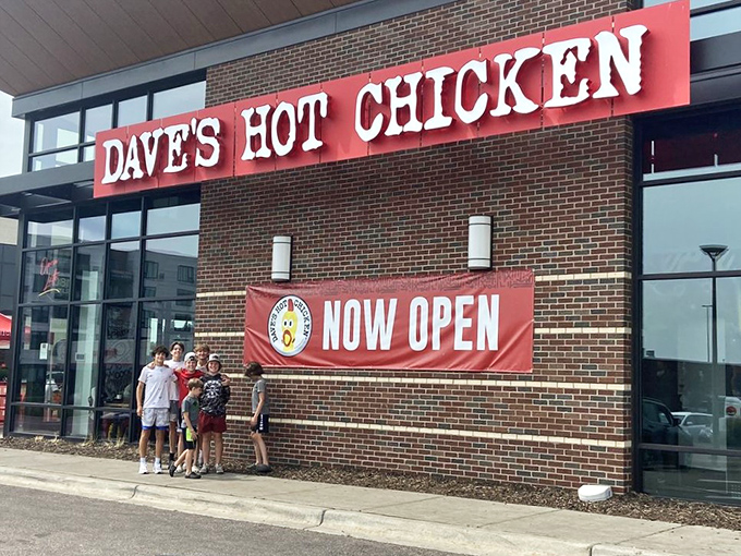 That bright red "Now Open" banner welcomes brave souls ready to test their spice tolerance with some seriously good hot chicken. P