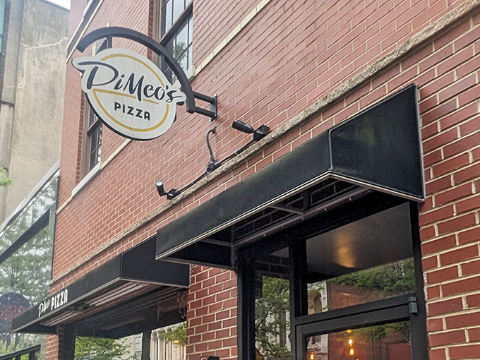 That round pizza logo spinning like a beacon for hungry souls seeking authentic comfort.