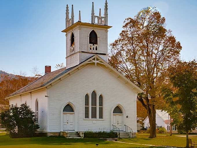 Fall foliage frames Dorset's iconic white church – Mother Nature showing off her seasonal color palette with religious devotion.