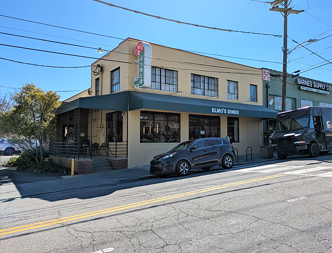 Sunshine bathes Elmo's brick exterior while hungry patrons make their pilgrimage. Some wait for heaven, others just wait for breakfast here.