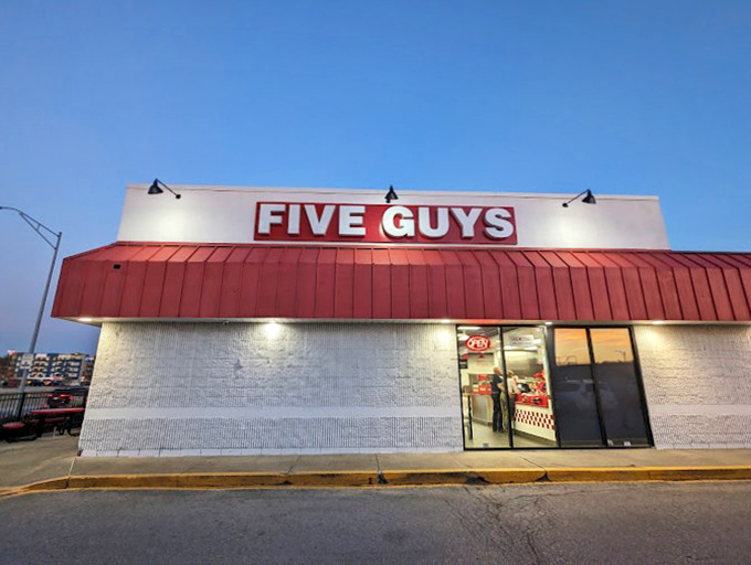 Five Guys after dark&mdash;where hot dog dreams come true. That glow is practically saying "Open sesame" to your appetite!