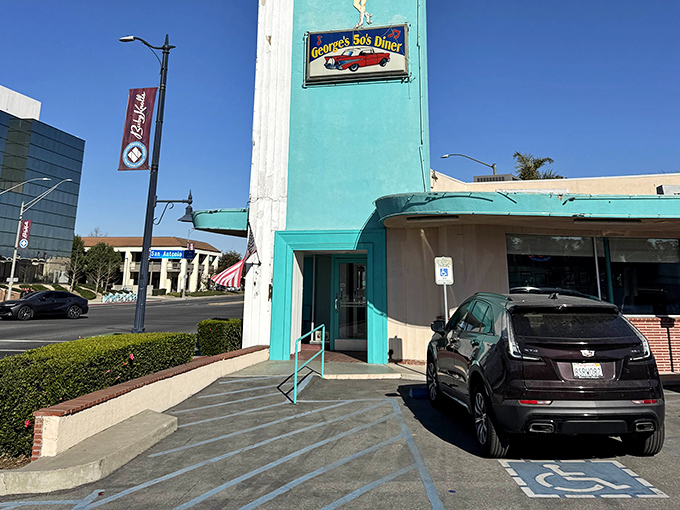 The turquoise tower stands like a mid-century lighthouse, guiding hungry souls to burgers and shakes in Long Beach.
