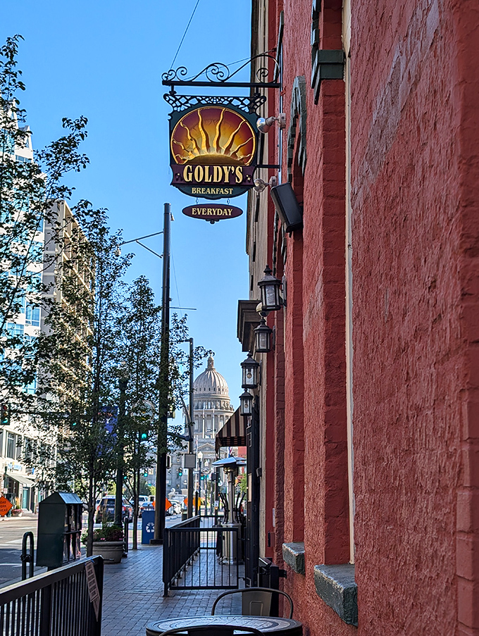 That classic hanging sign promises golden mornings and perfectly brewed coffee just steps away inside. 