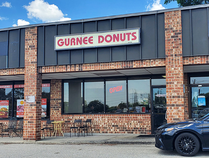Bright signage against dark panels &ndash; Gurnee Donuts knows how to make an entrance in the strip mall universe.