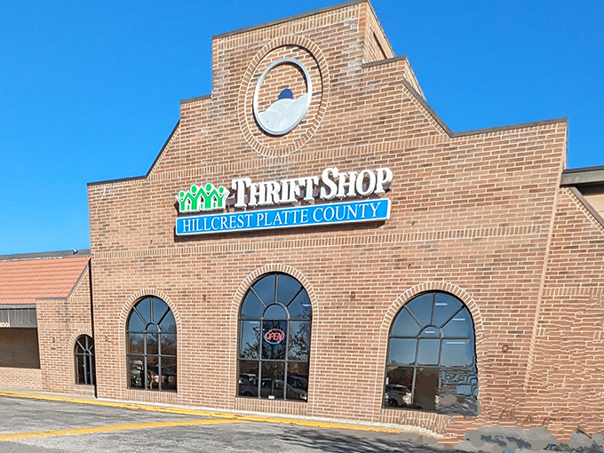 Architectural details elevate this thrift shop experience beyond the ordinary. The brick facade and distinctive windows create an inviting shopping atmosphere.