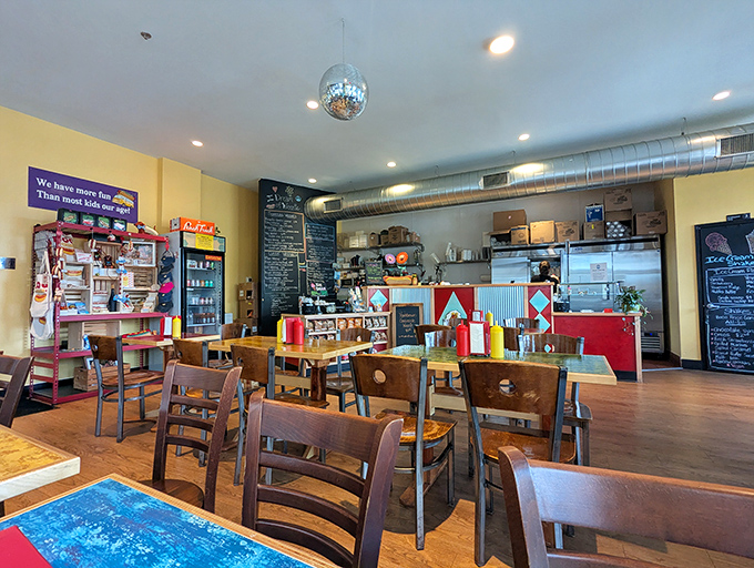 Inside this cheerful space with disco balls and colorful decor, hot dogs become an art form worth celebrating together.