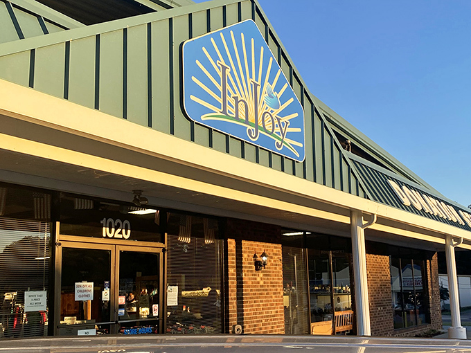 The sunny blue sky complements InJoy's cheerful storefront. A beacon of bargains that would make even the most dedicated mall-shopper curious!