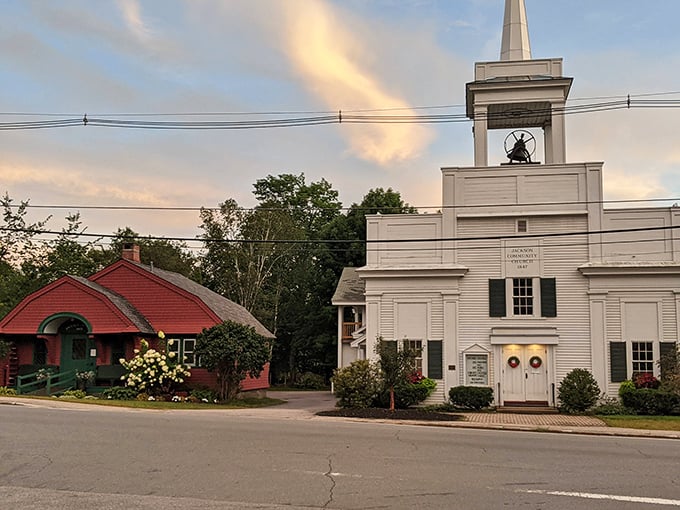 Evening light falls softly over Jackson&rsquo;s heart &mdash; where community, history, and small-town warmth meet beneath the bell tower and beside the red cottage.