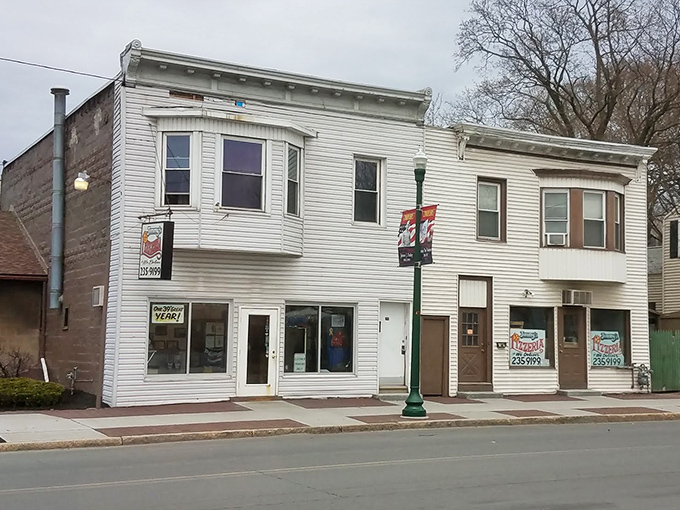 Small-town charm meets serious pizza-making at Jimmy's. This white building has been feeding Troy families long before "artisanal" was a buzzword.